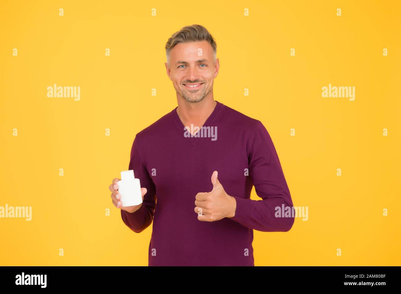 Product for sale. Happy guy give thumbs up to product. Handsome man ...