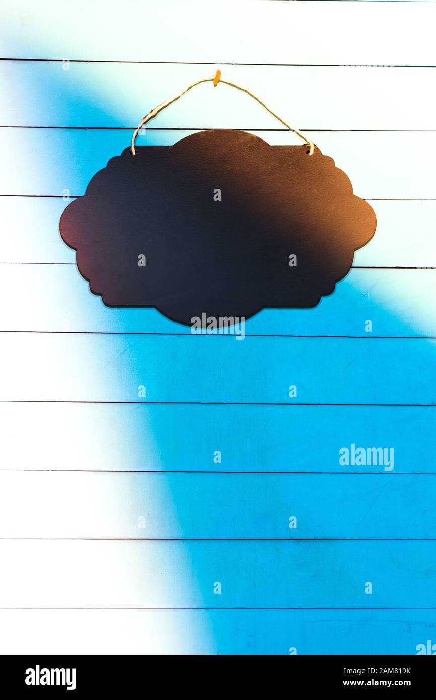Black Empty Sign Board with string for hanging on wall Stock Photo - Alamy
