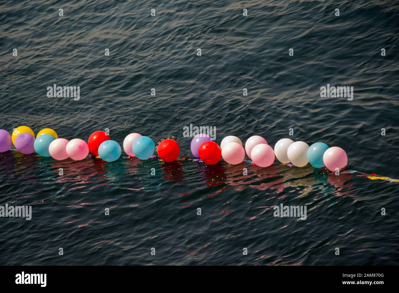 Balloons in shooting range as targets on water Stock Photo - Alamy