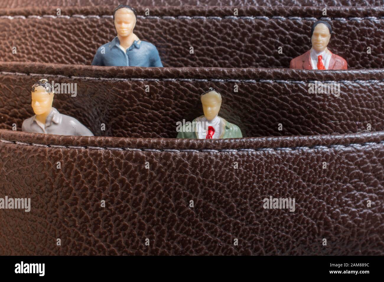 Tiny figurine of group of men miniature model in pockets Stock Photo ...