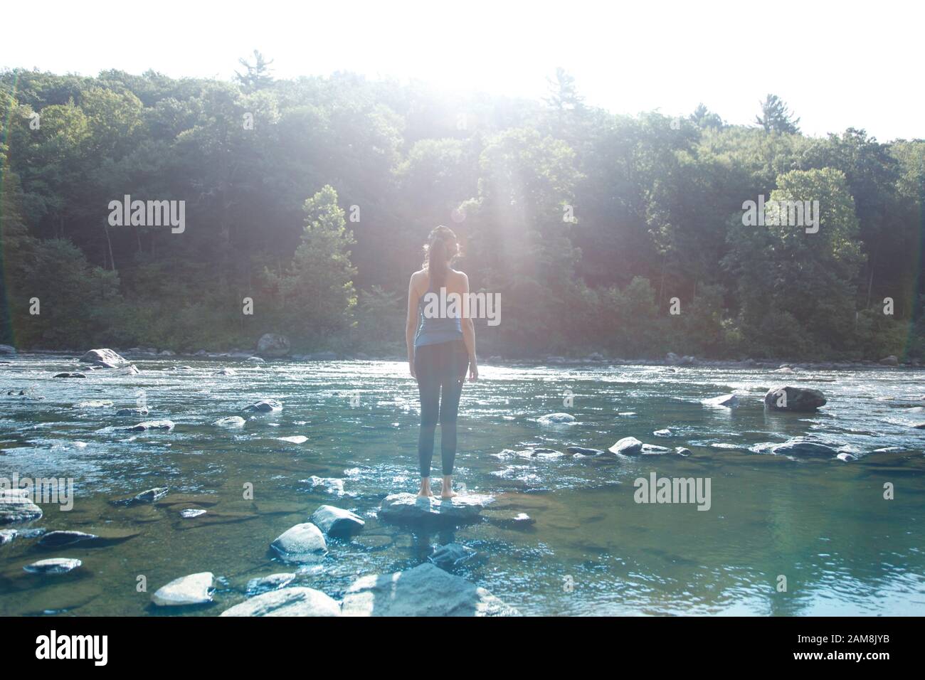 Woman standing facing away hi-res stock photography and images - Alamy
