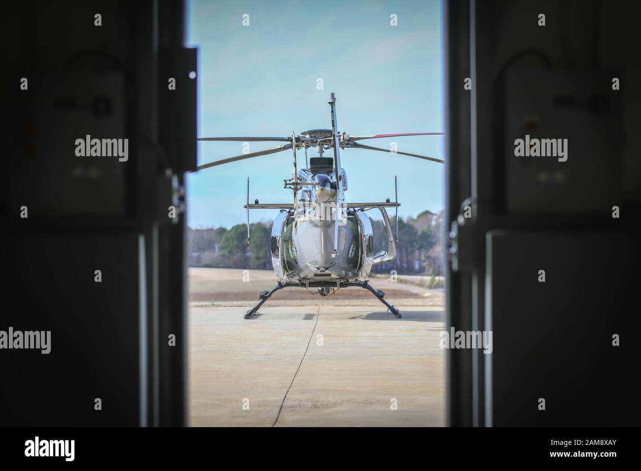 A North Carolina State Trooper helicopter sits outside a hanger before ...