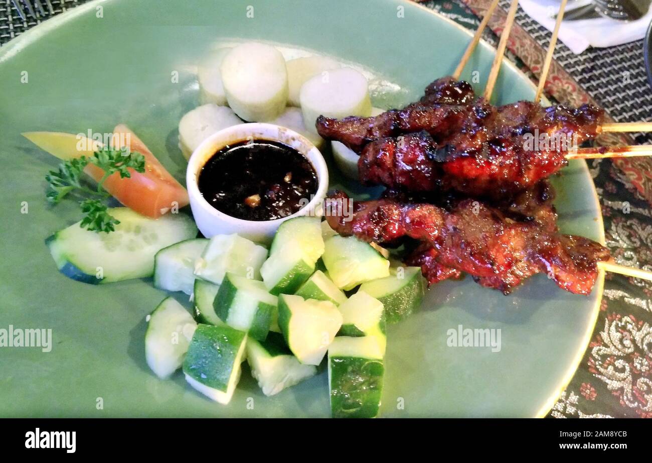 lontong rice and satay skewers Stock Photo - Alamy