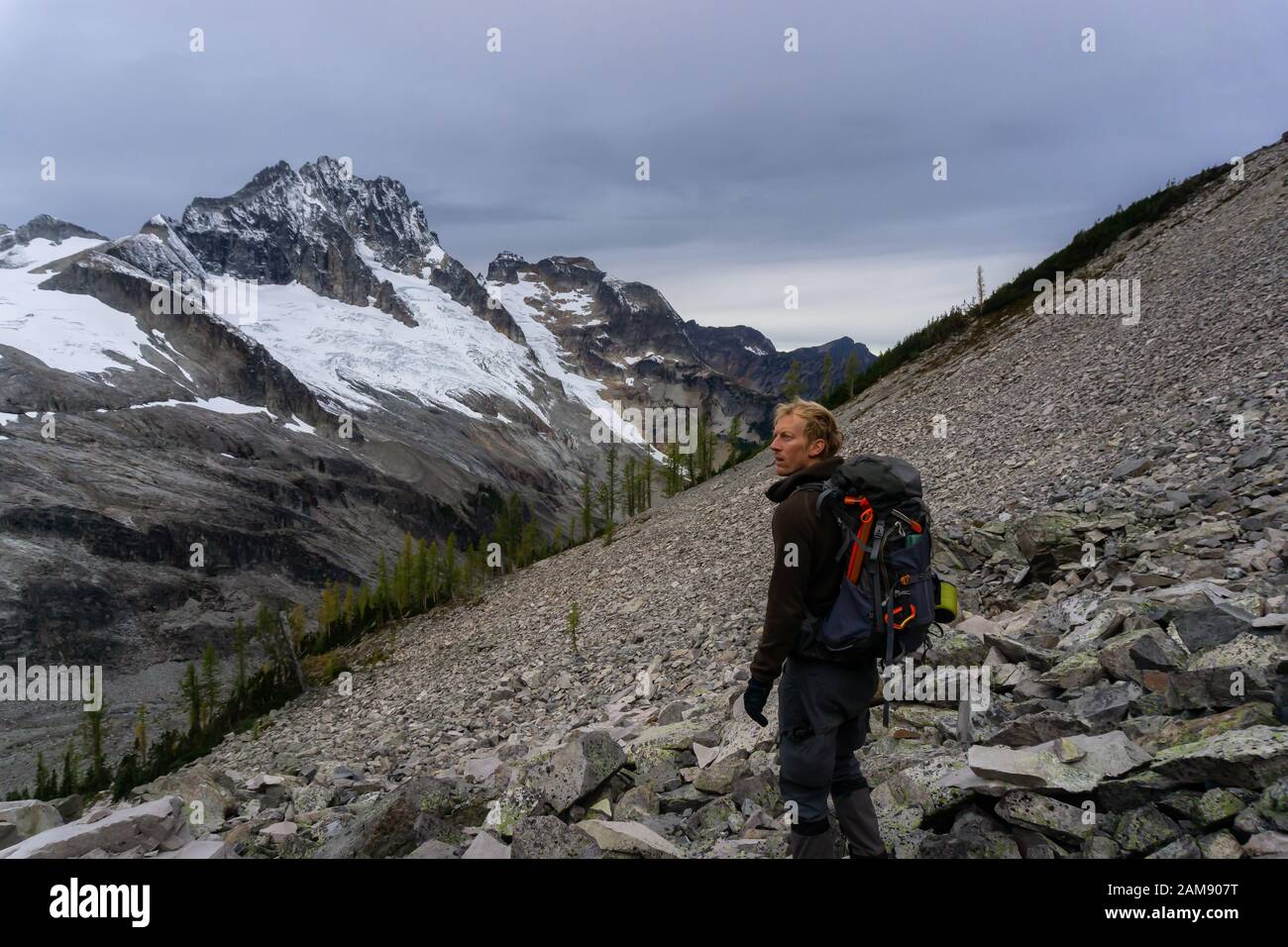 Adventurous man is hiking in the Beautiful Canadian Mountain Landscape ...