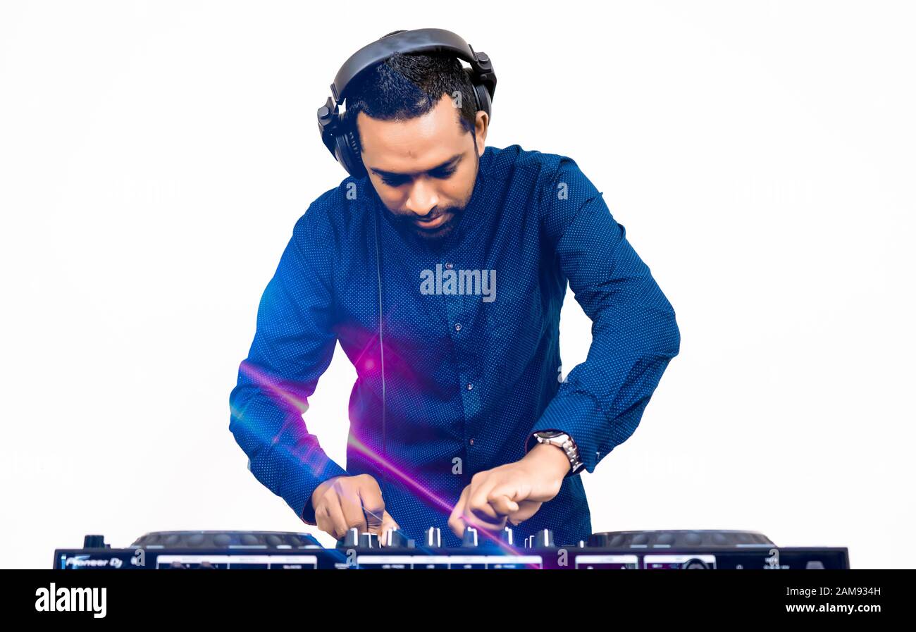 Male DJ playing music on white background Stock Photo - Alamy