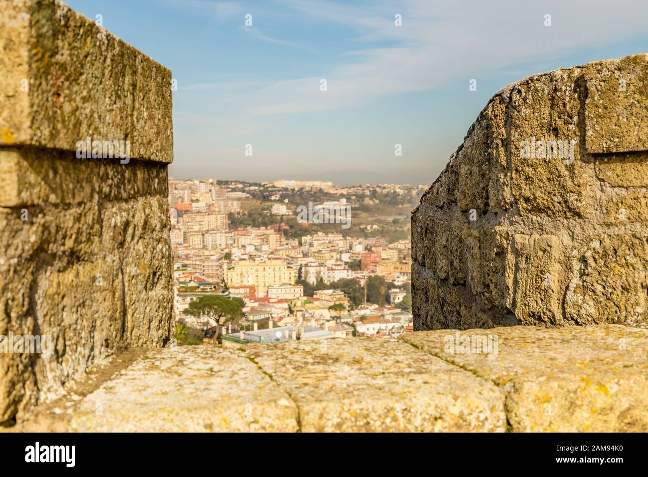 amazing view of the roofs of Napoli, Italy trough medieval rock window ...