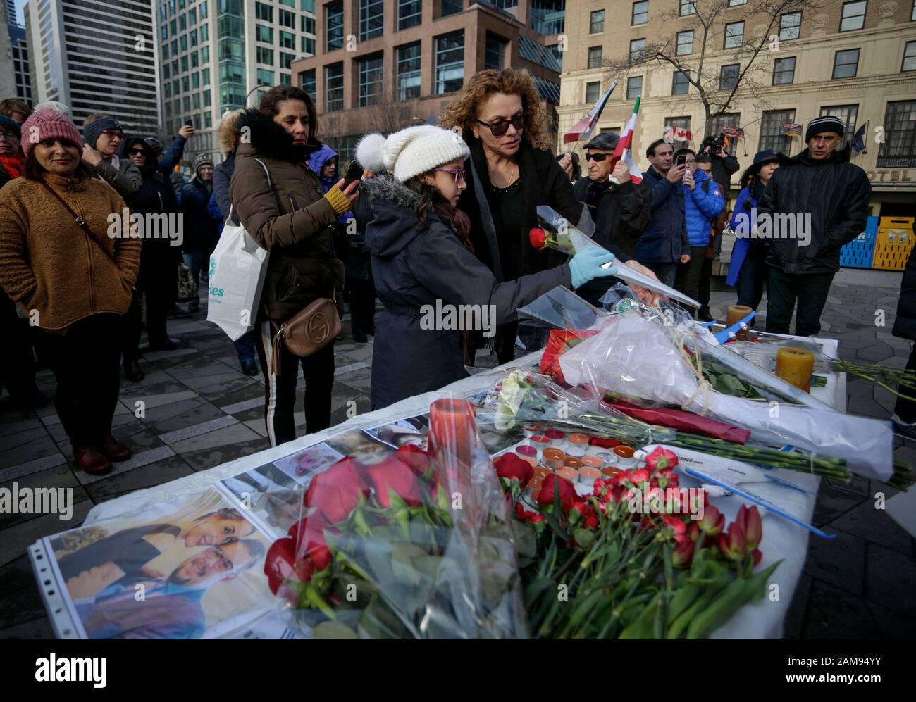 Vancouver, Canada. 11th Jan, 2020. People attend a vigil outside ...