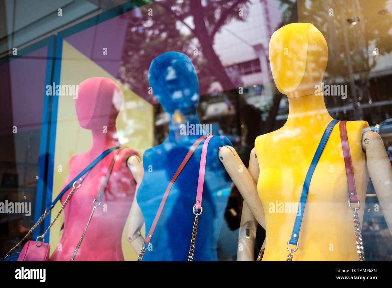 Female mannequins display inside a glass window Stock Photo - Alamy