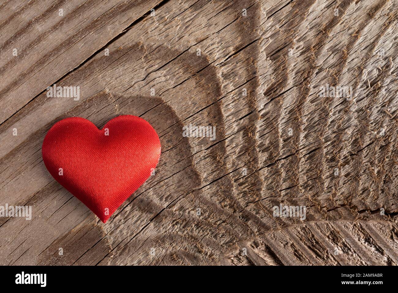 Valentine's day red silk heart on wooden background, love concept Stock ...