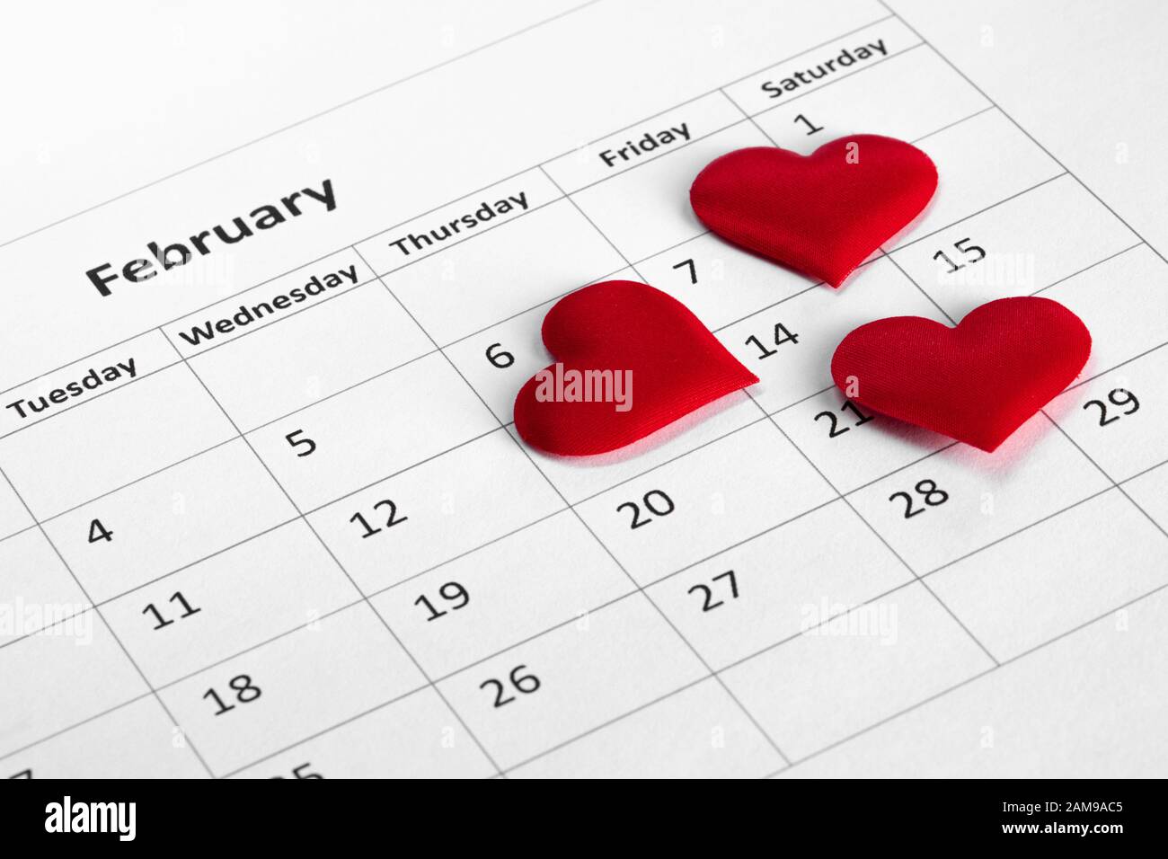 Valentine's day red silk hearts on calendar with 14 february date ...