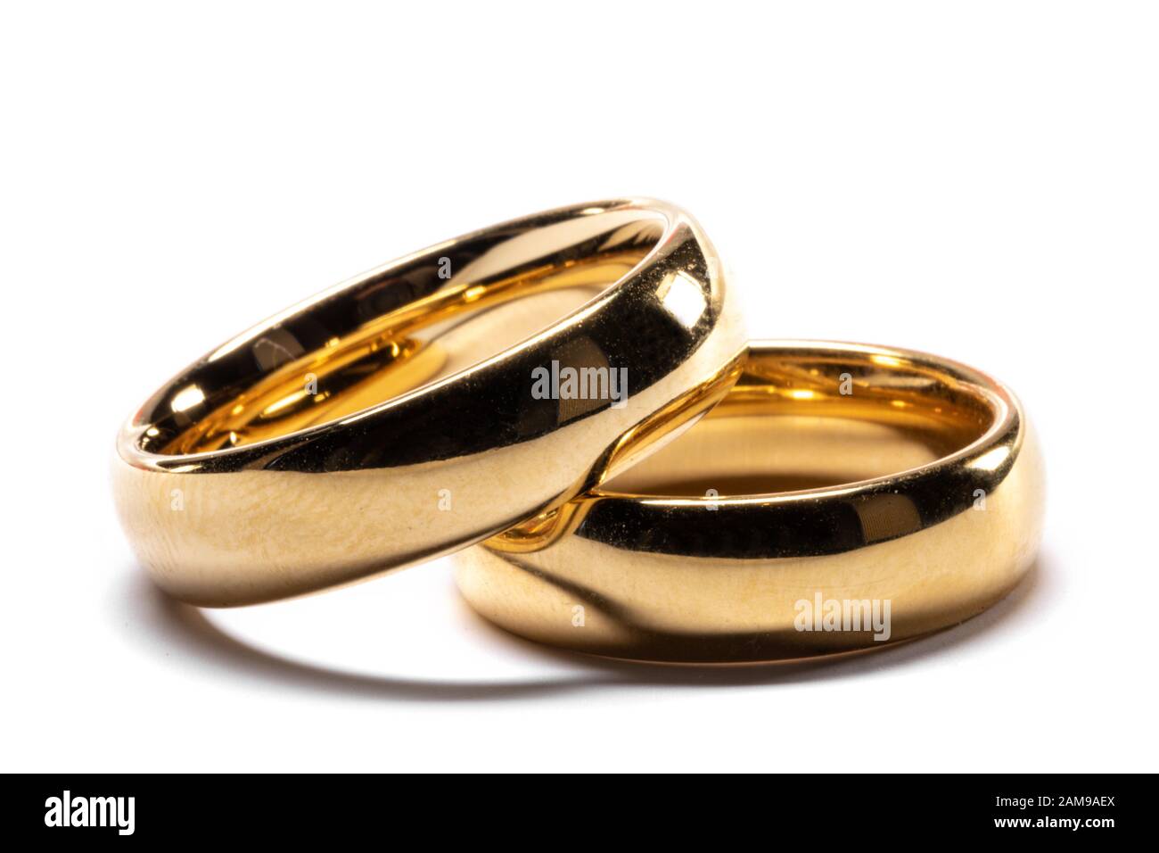 Couple of gold wedding rings isolated on white background Stock Photo ...