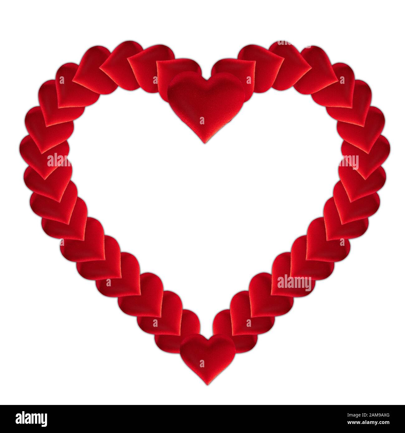 Valentine's day many red silk hearts in heart shape isolated on white ...