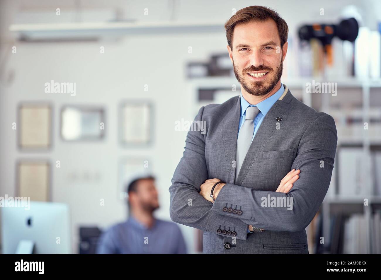 Portrait of successful business man at office Stock Photo - Alamy