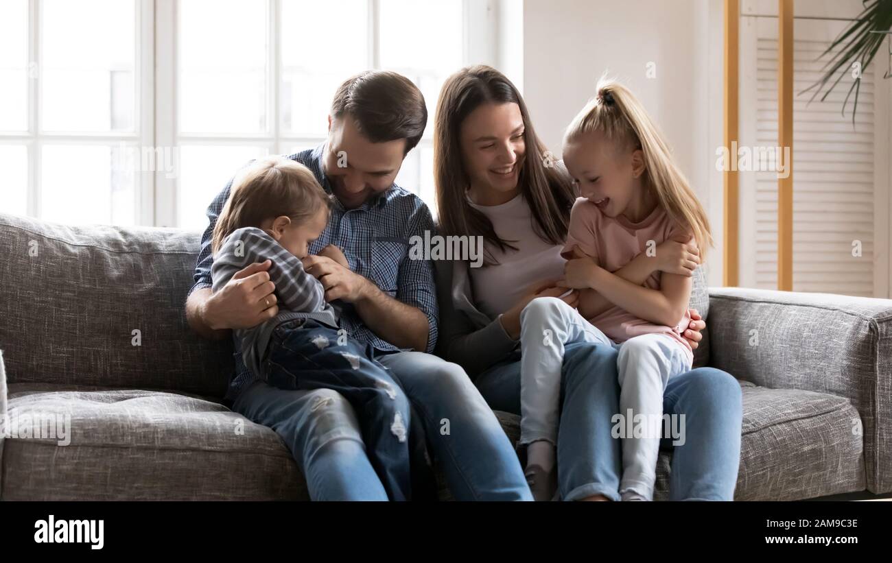 Happy young family with kids have fun at home Stock Photo - Alamy