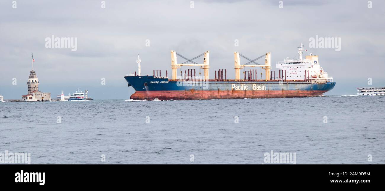 Black and red merchant ship in the strait. Carrying container. Maiden's ...