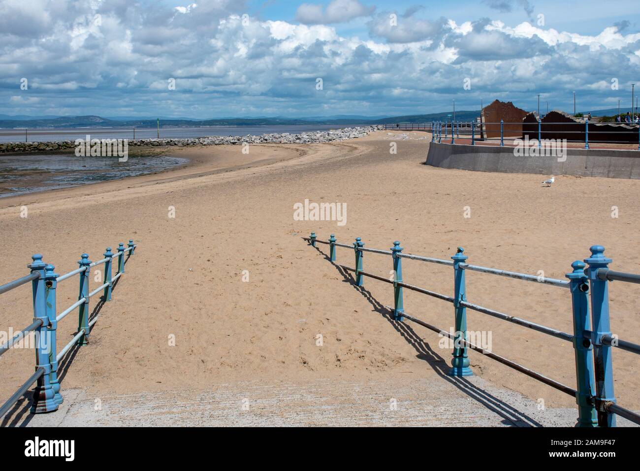 Sandy path to Morecombe beach with blue handrails Stock Photo - Alamy