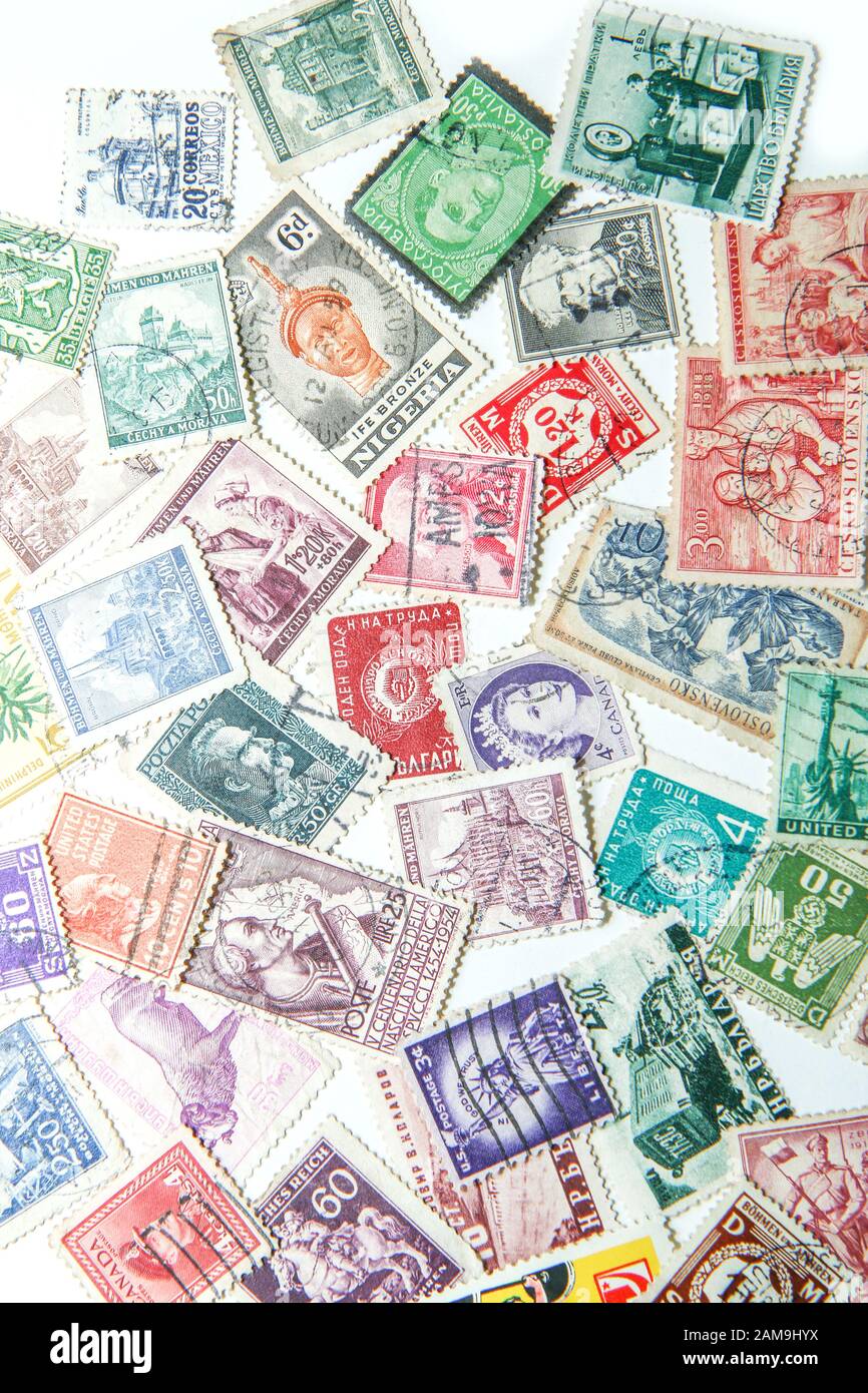 An assorted mixture of the old european and world stamps is lying on ...