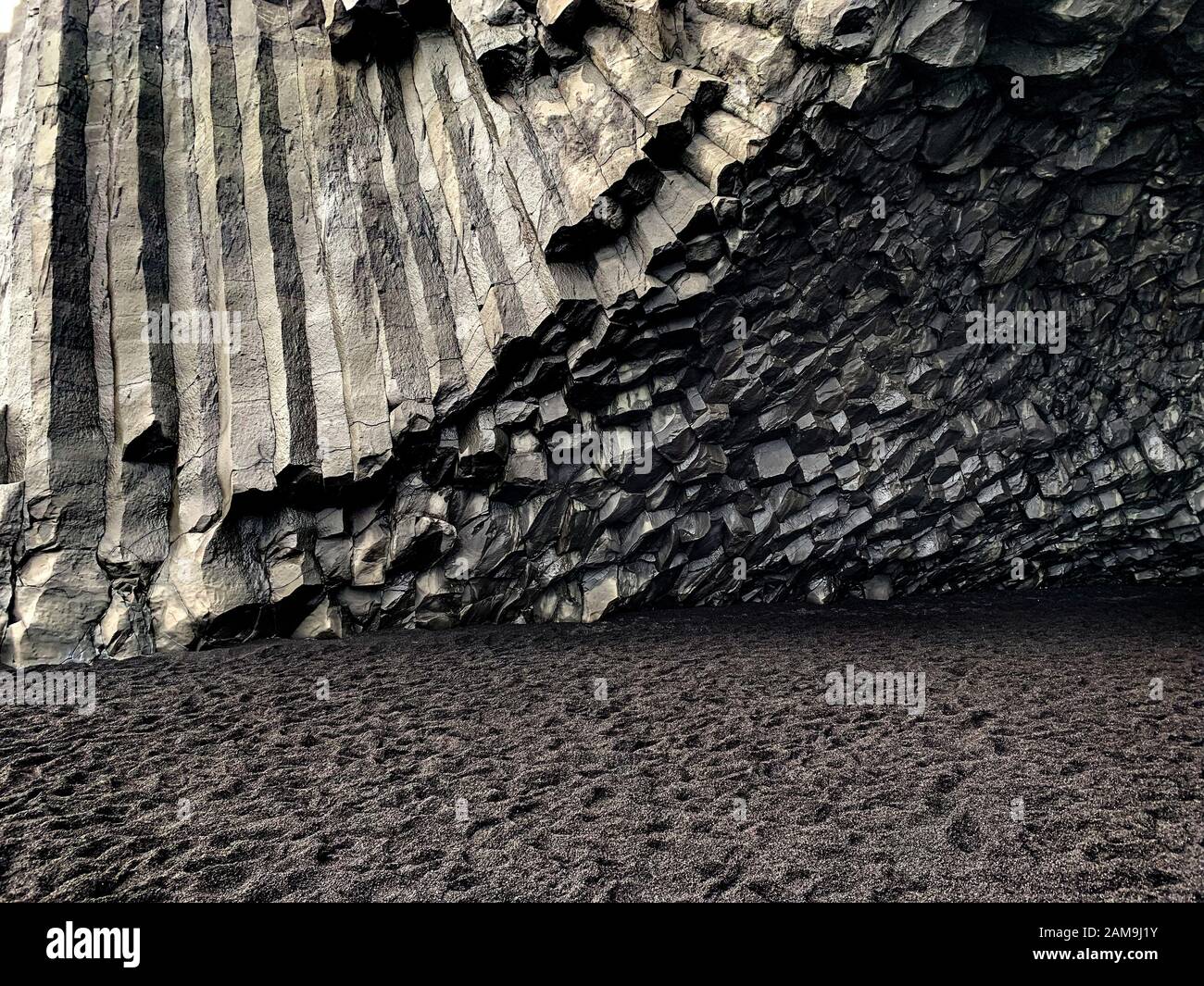 Basalt Columns created when lava hardens, black volcanic beach of Vik ...