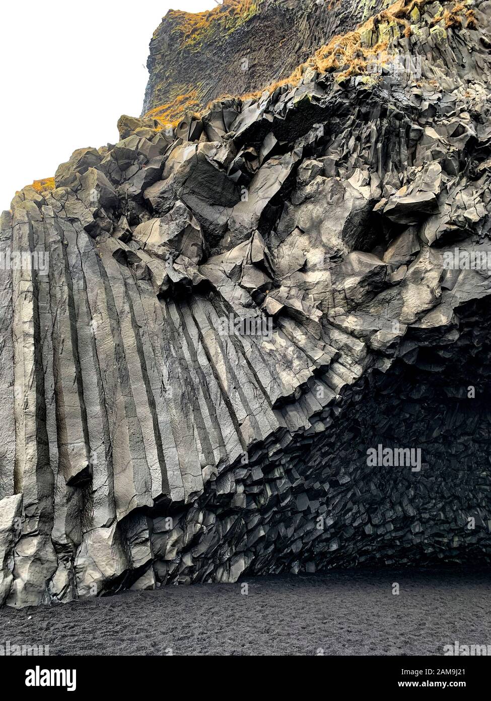 Basalt Columns created when lava hardens, black volcanic beach of Vik ...
