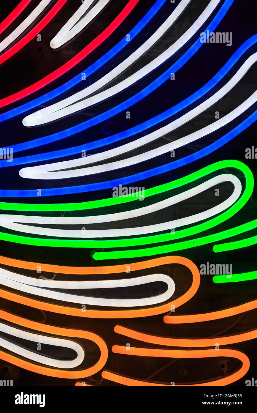 Colorful fluorescent light neon on black background Stock Photo - Alamy