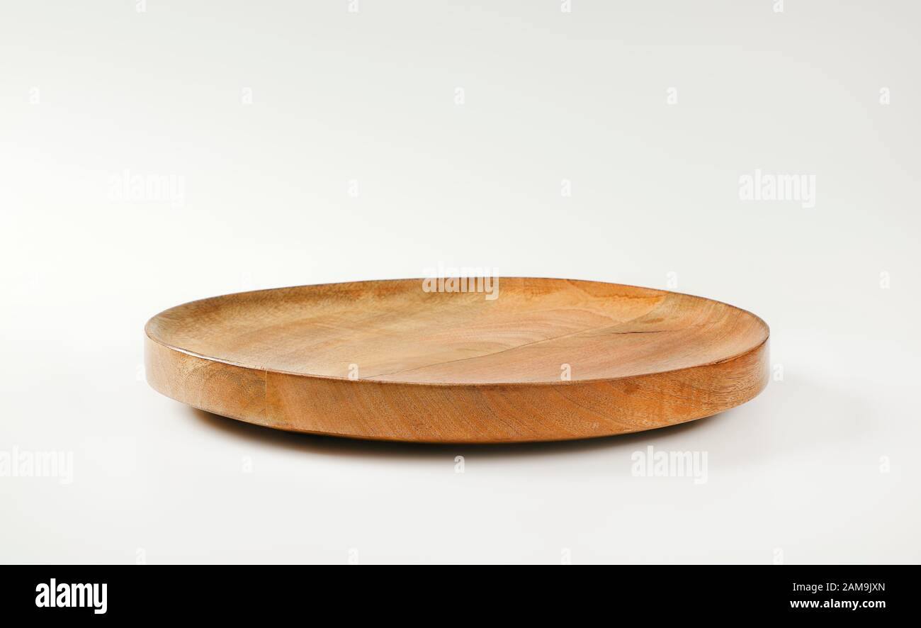 Empty round wooden platter for serving cheese, fruit and other food ...