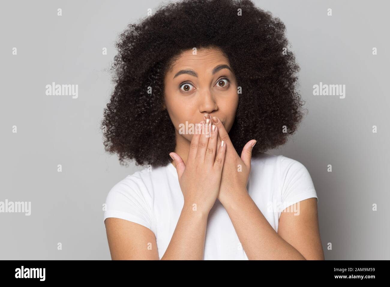 Surprised Millennial African Americam Lady Covering Mouth With Hands
