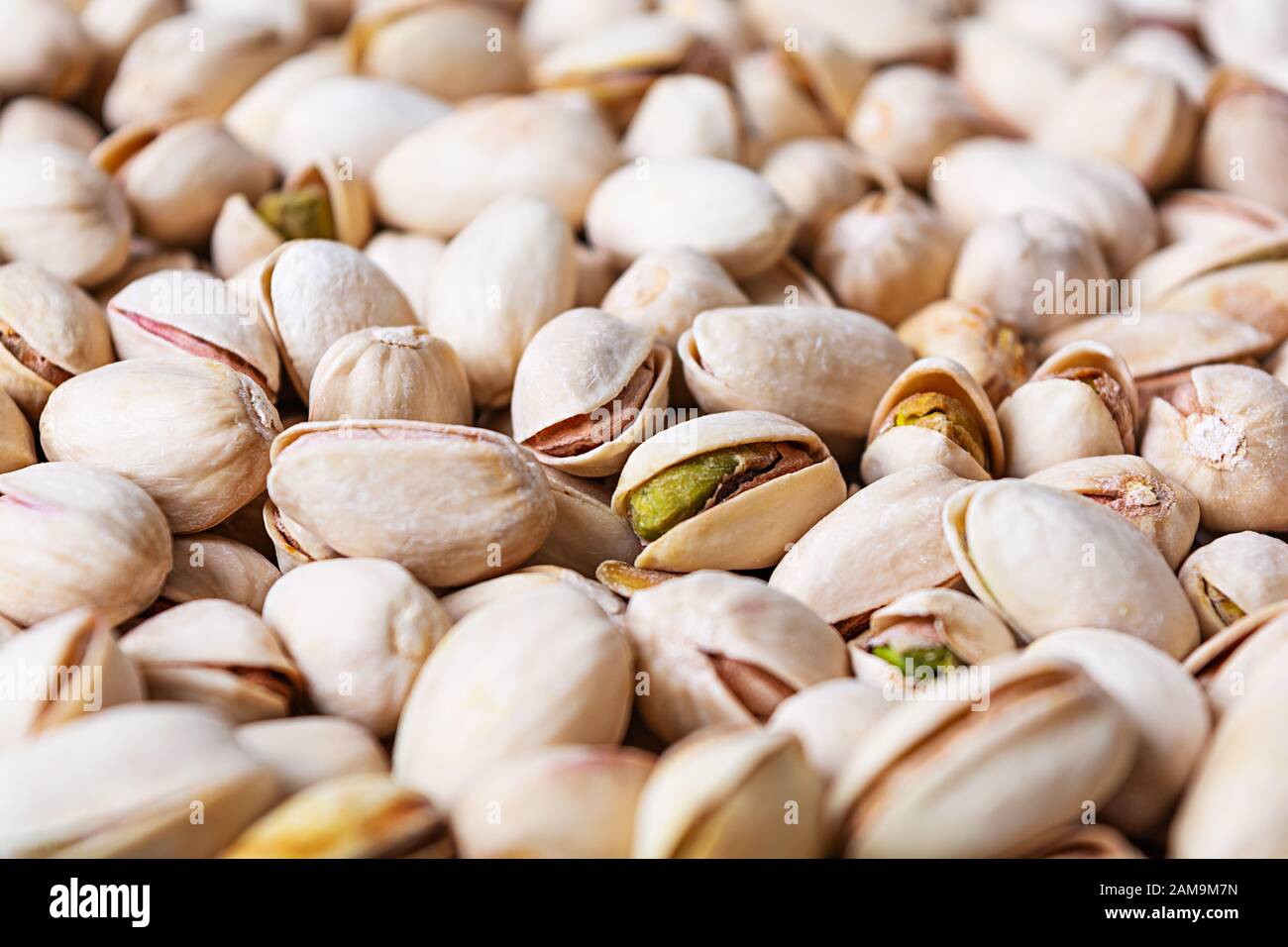 Background of pistachio nuts. Roasted salted pistachios Stock Photo - Alamy