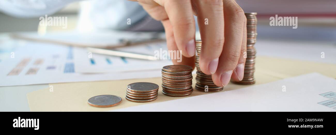 Hand businessman putting pin money Stock Photo - Alamy