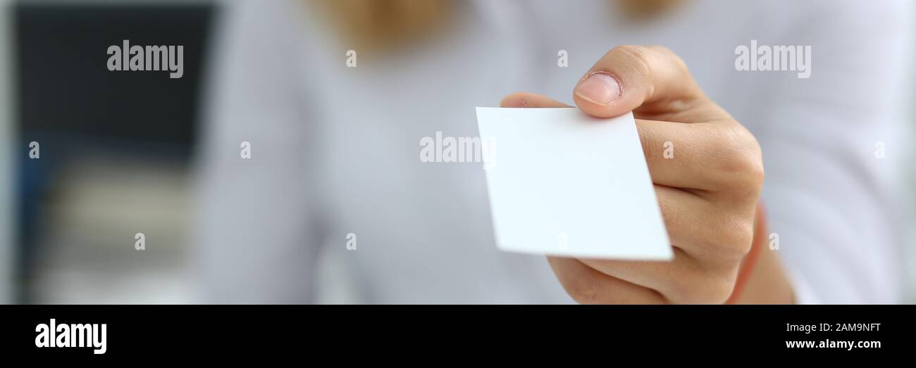 Female hand in suit give blank calling card to male Stock Photo - Alamy