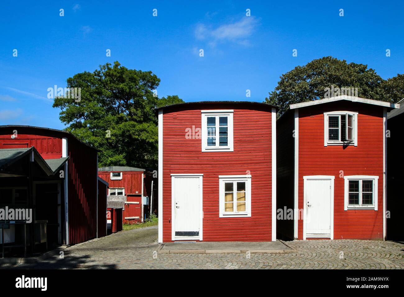 Several nice tiny wooden falun red houses for the fishermen in Swedish ...
