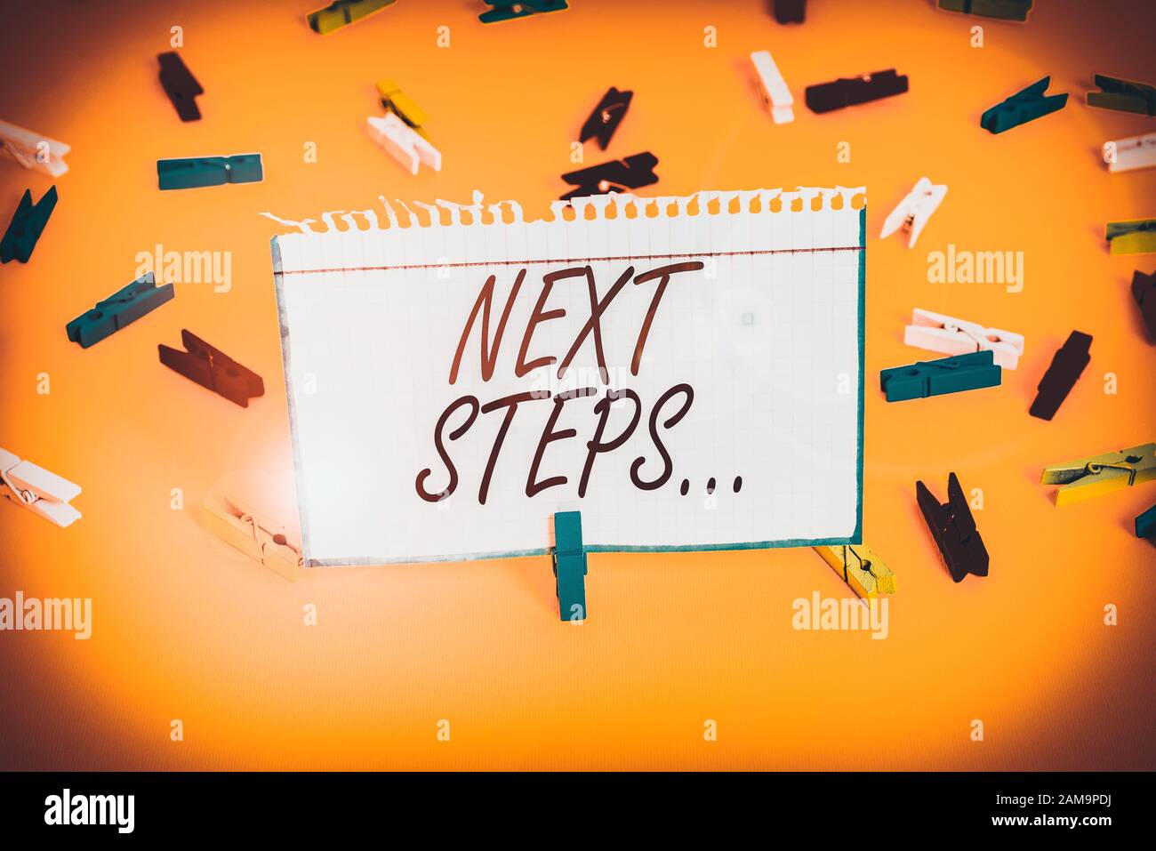Writing note showing Next Steps. Business concept for something you do ...