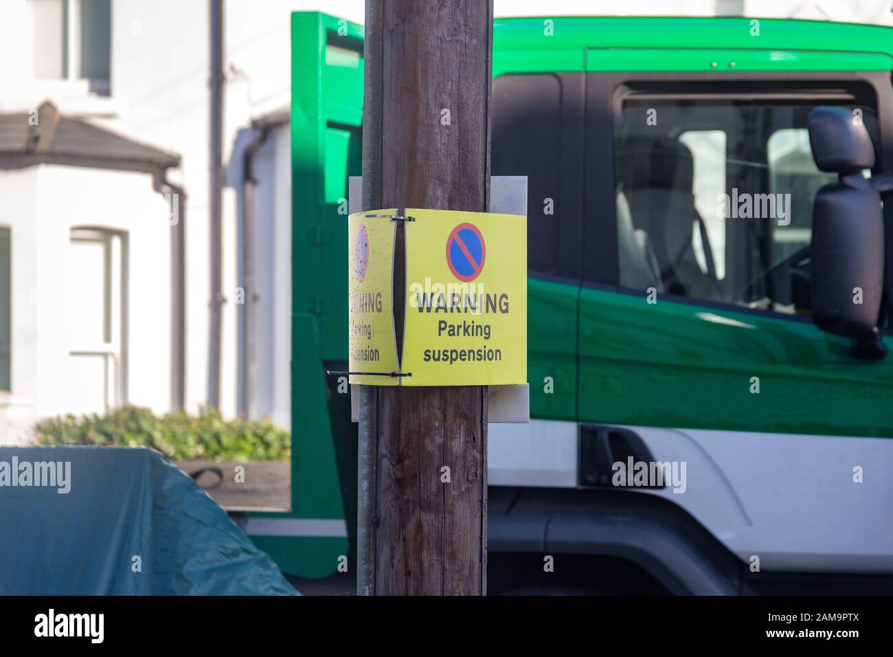Parking suspension warning sign board on a residential London street ...