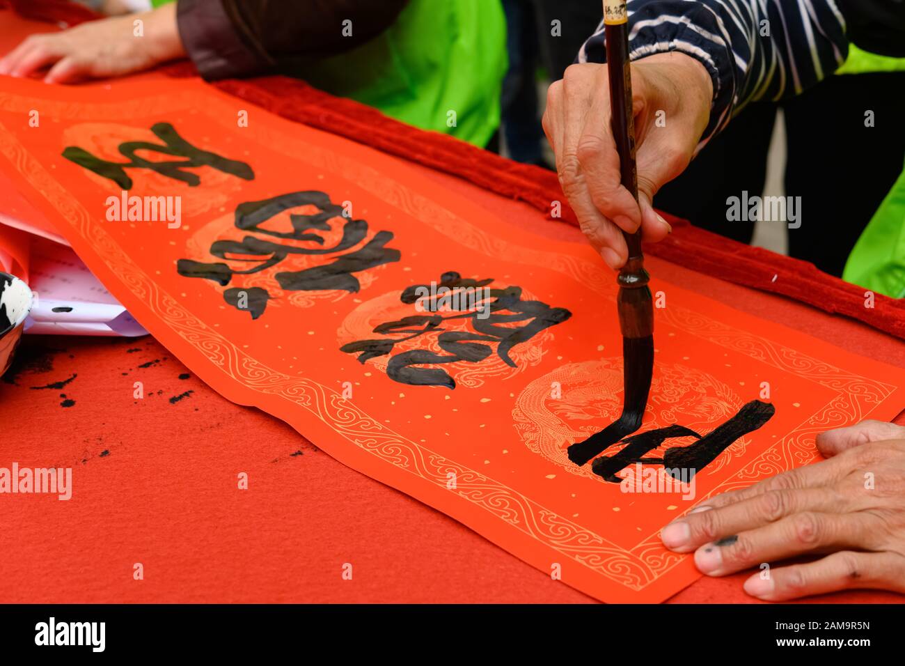 writing Chinese new year scrolls the Chinese means good luck is coming ...