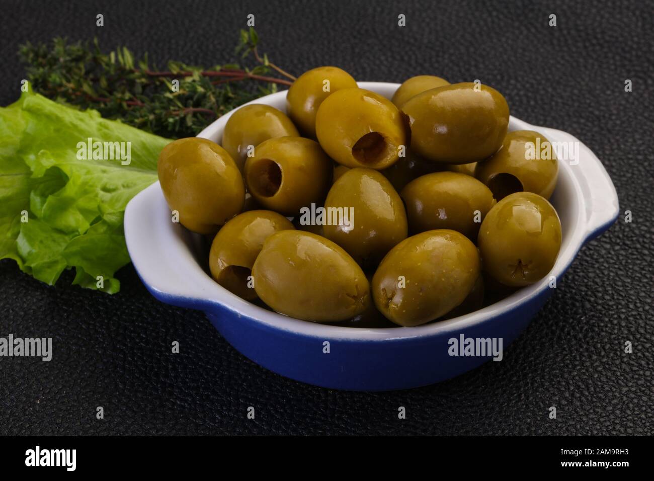 Big green olives in the bowl Stock Photo - Alamy