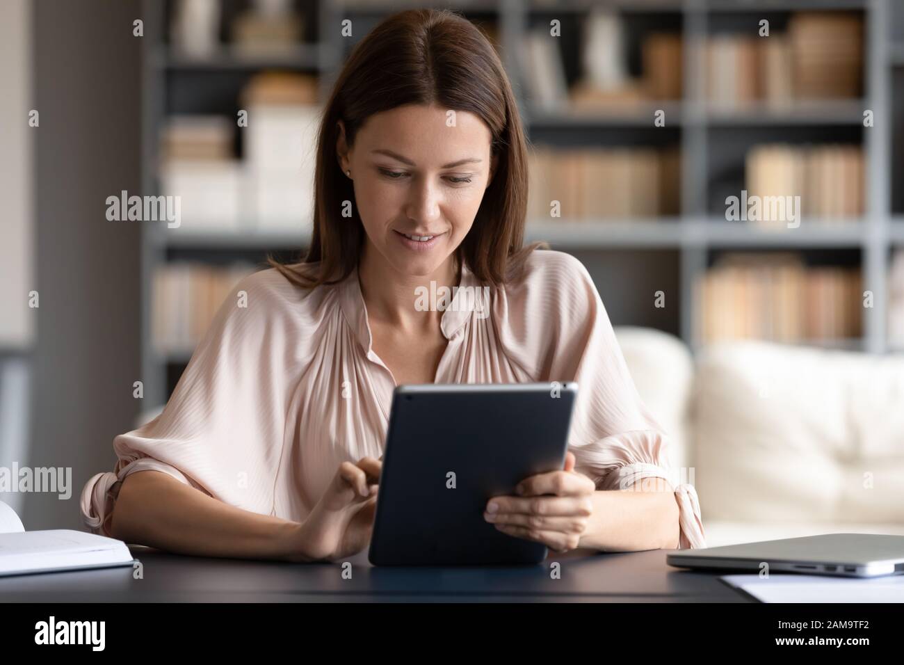 Millennial girl browsing internet on modern tablet Stock Photo - Alamy Millennial girl browsing internet on modern tablet Stock Photo - Alamy