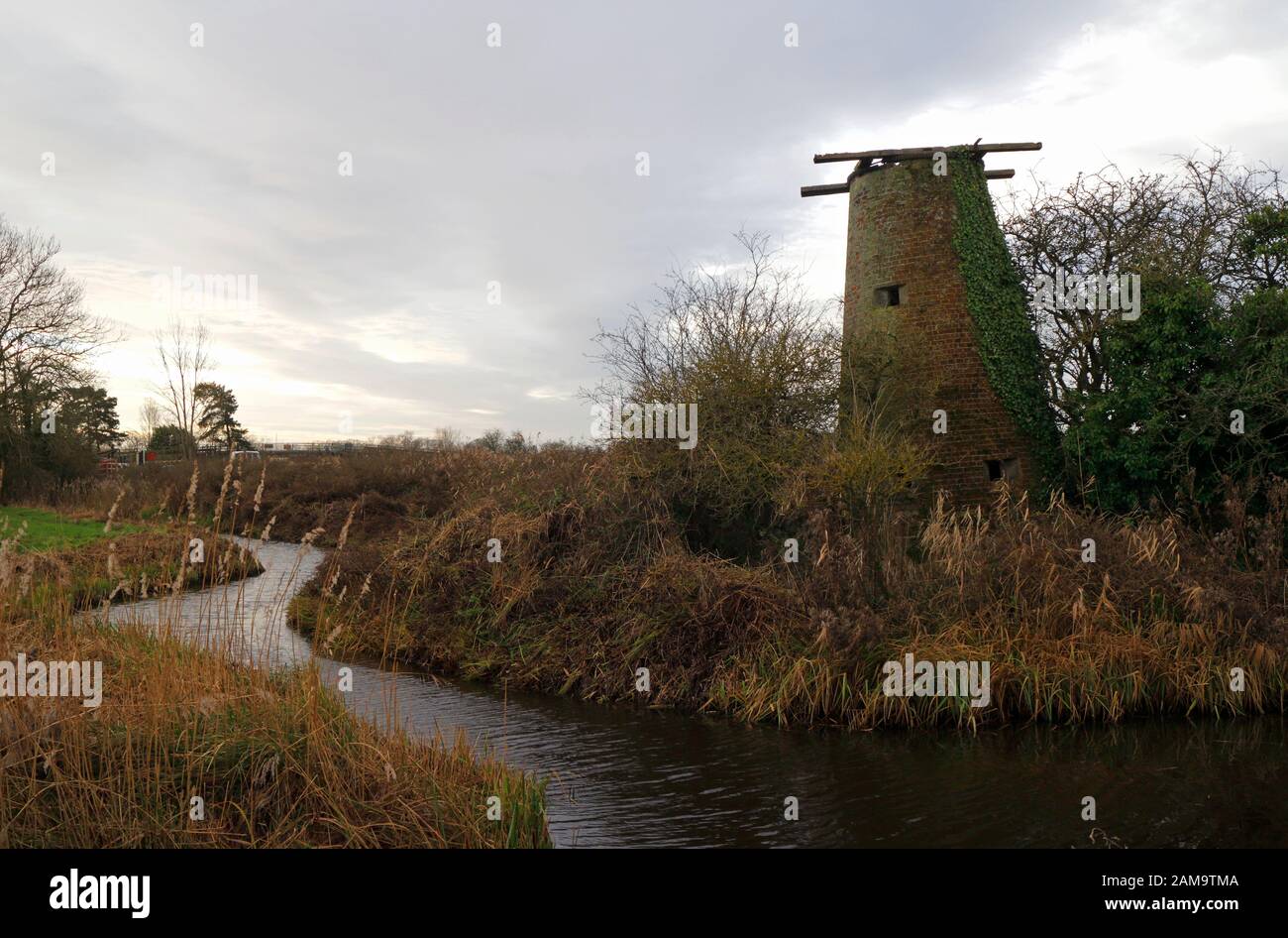 A view of the remains of Ludham Bridge Drainage Mill by a dyke by the ...