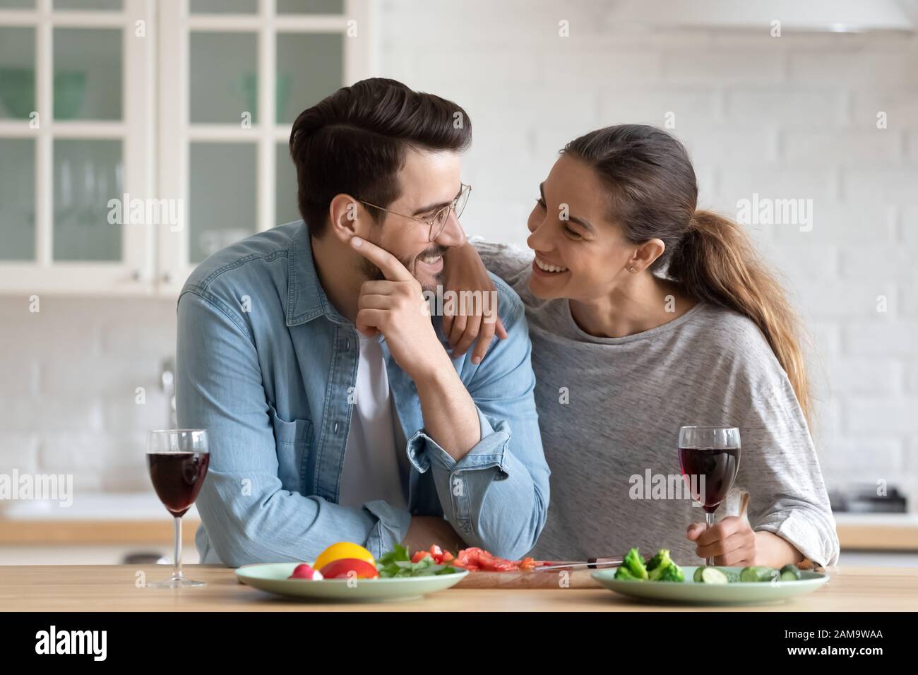 Happy loving family couple enjoying pleasant funny conversation at ...