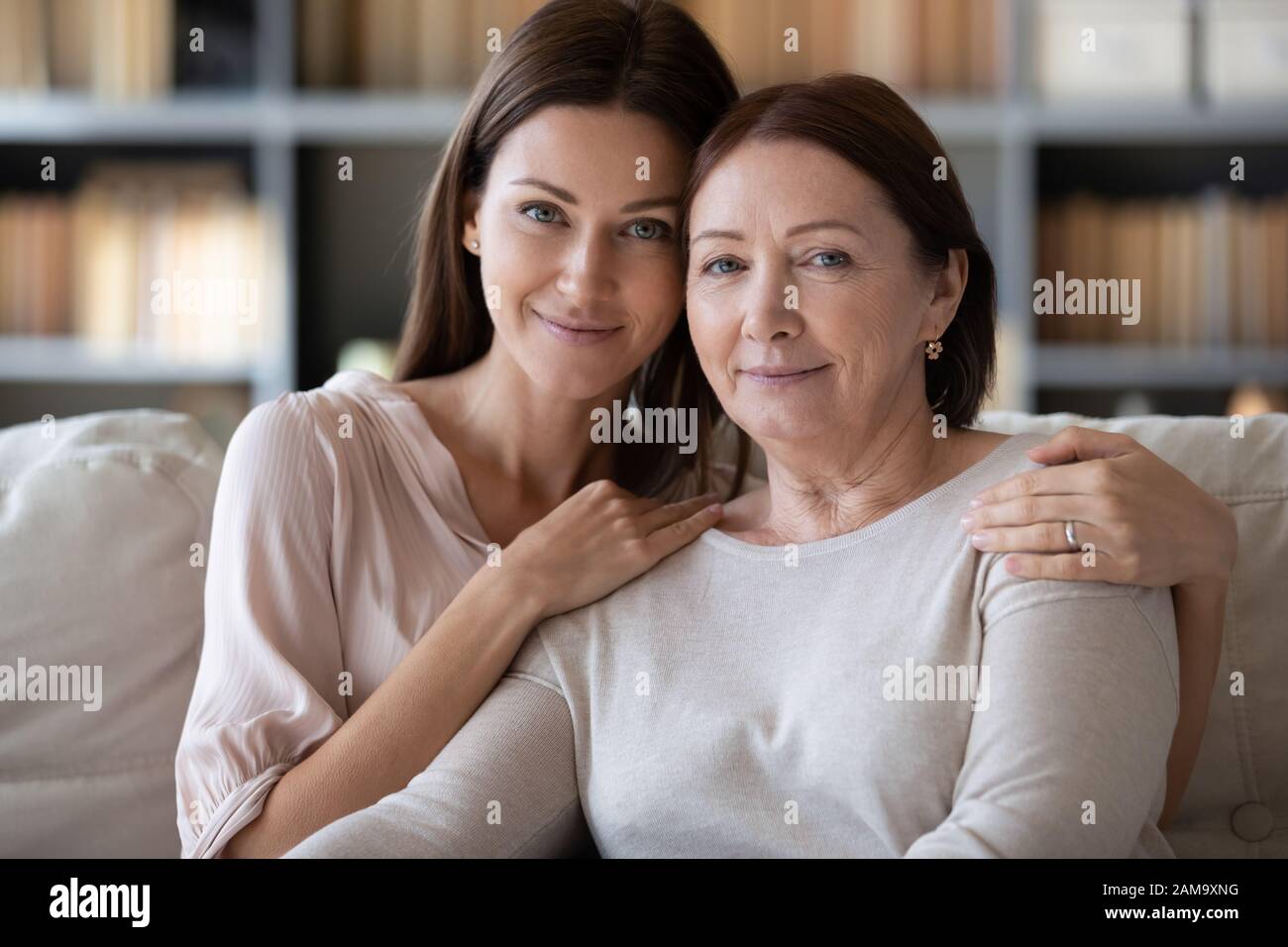 Headshot portrait of adult mum and daughter relaxing at home Stock ...