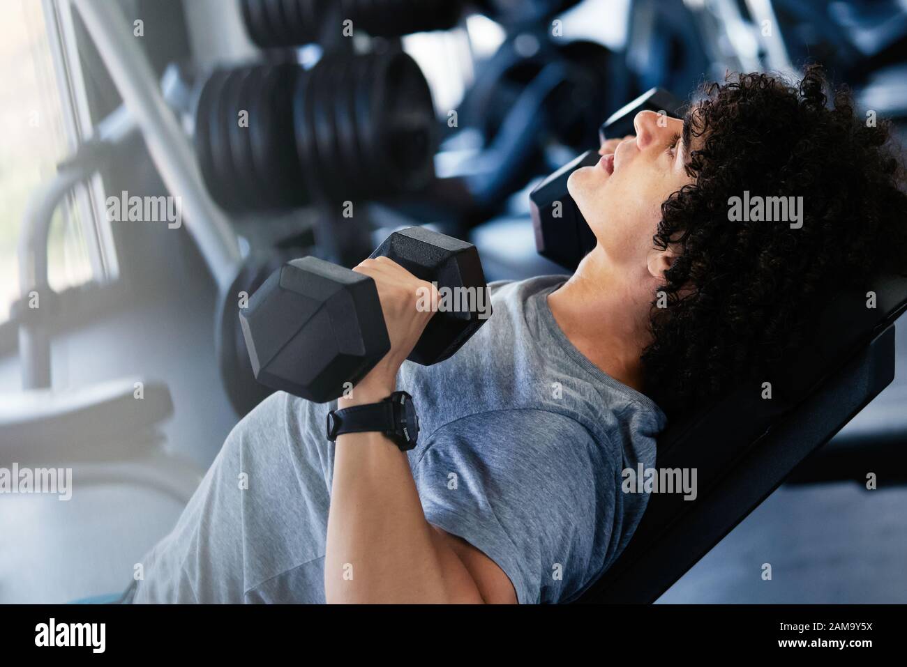 Healthy life and gym exercise concept. Fit man working out in sport ...