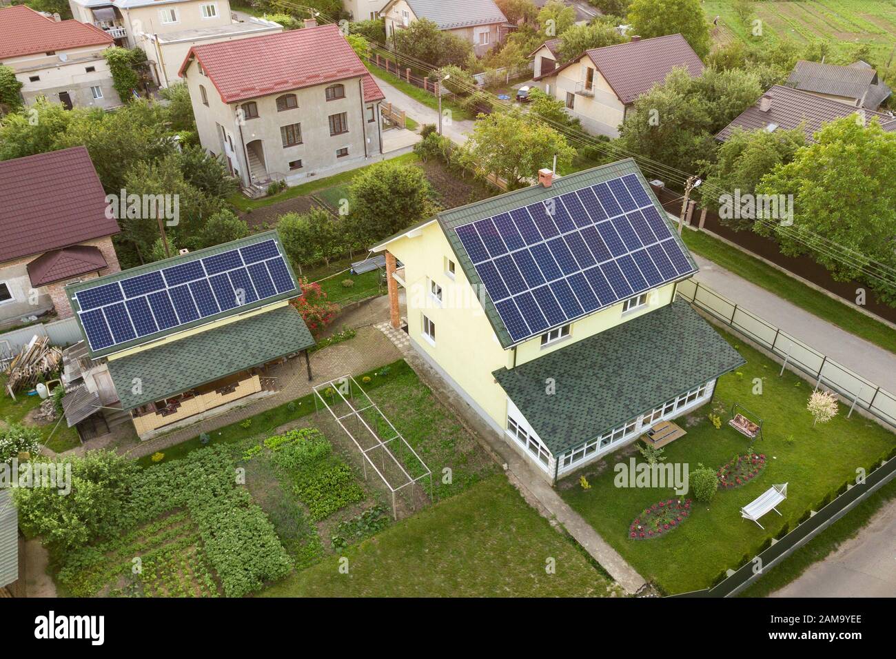 Aerial top view of new modern residential house cottage with blue shiny ...