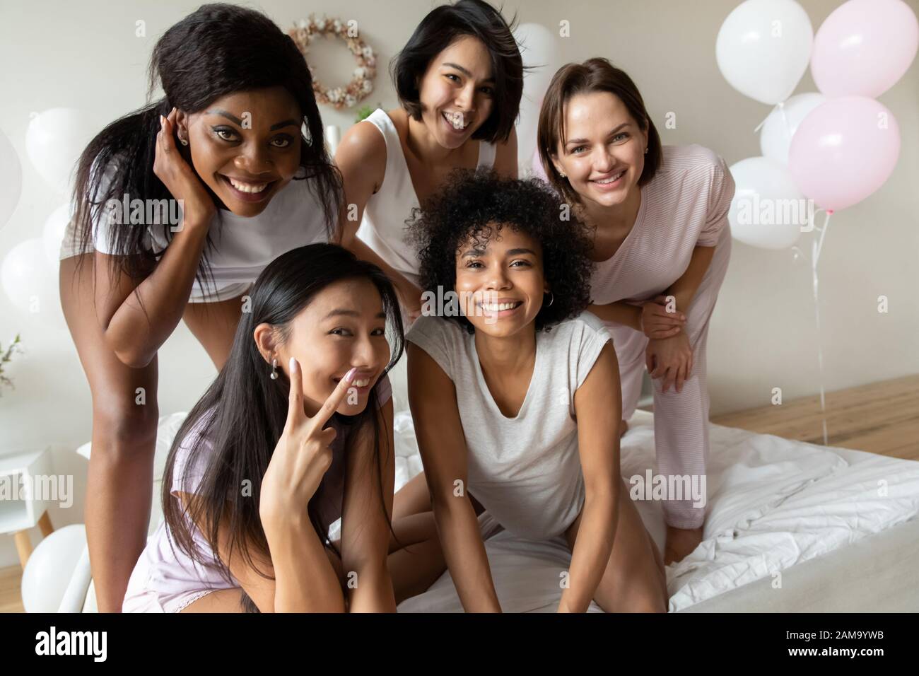 Portrait of happy girls celebrating hen party Stock Photo - Alamy