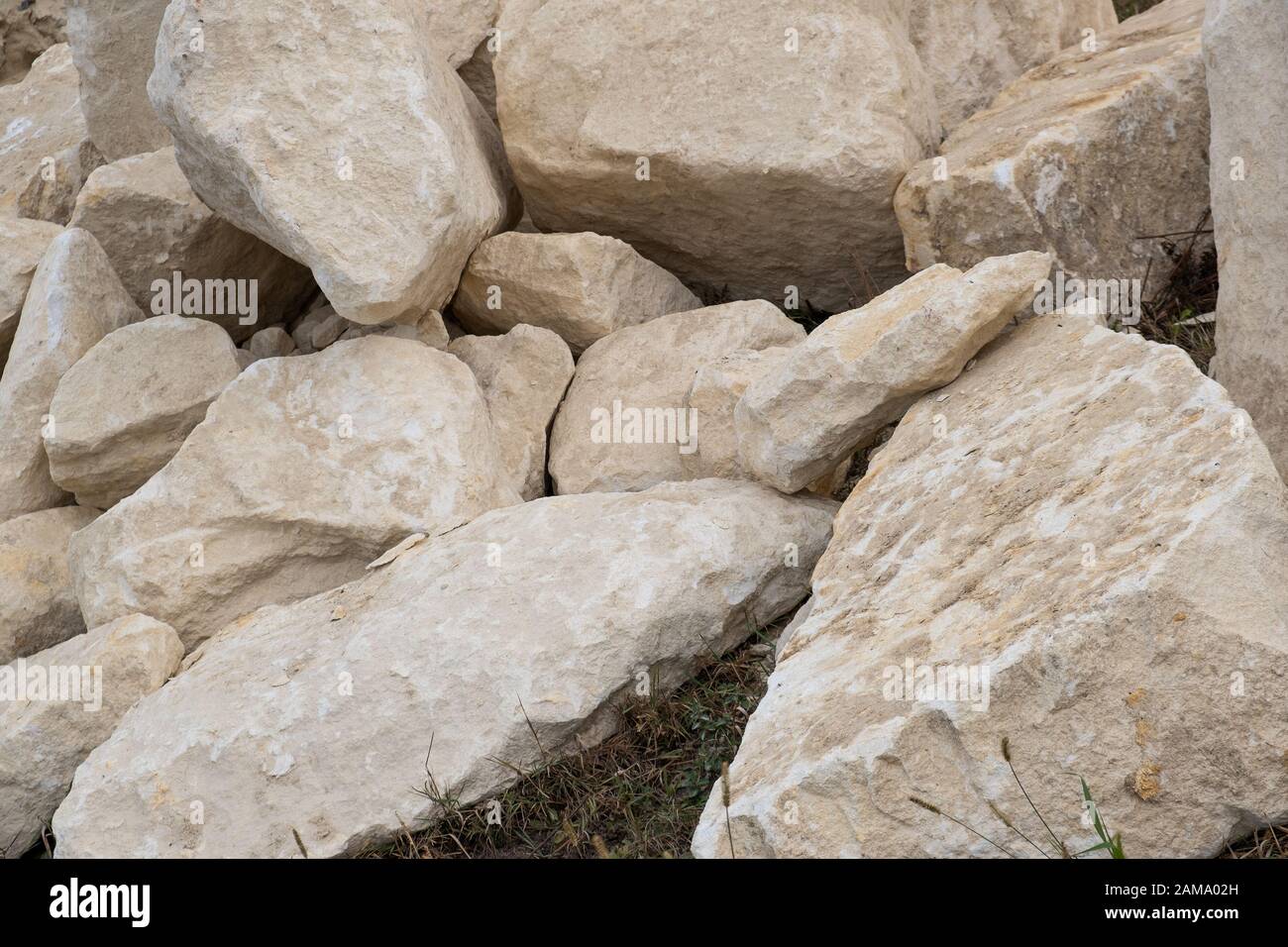Big pile of large sand stones laying on the ground of construction site ...