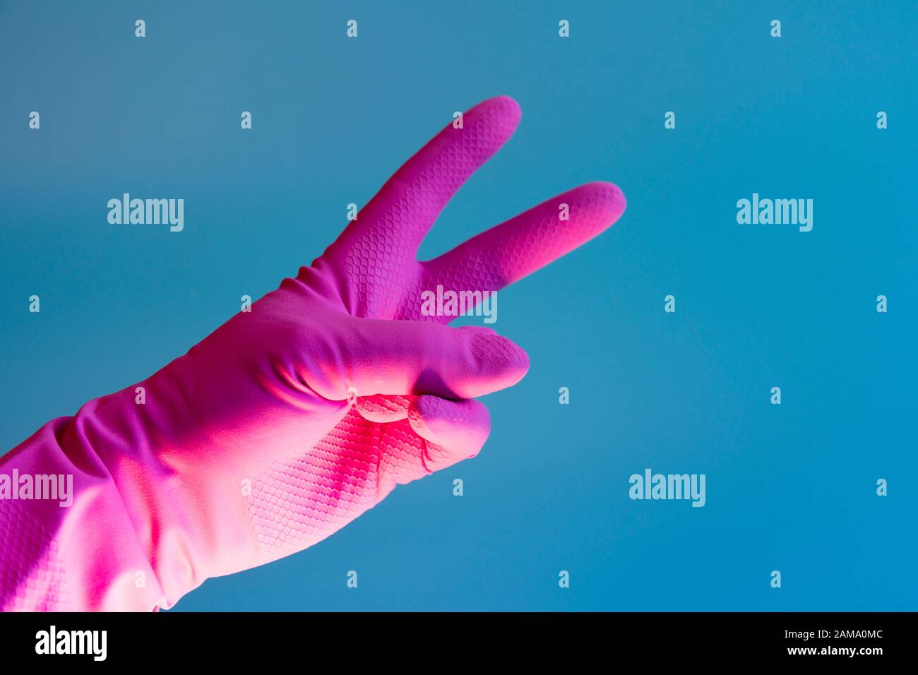 Hand with cleaning glove making fist Stock Photo - Alamy