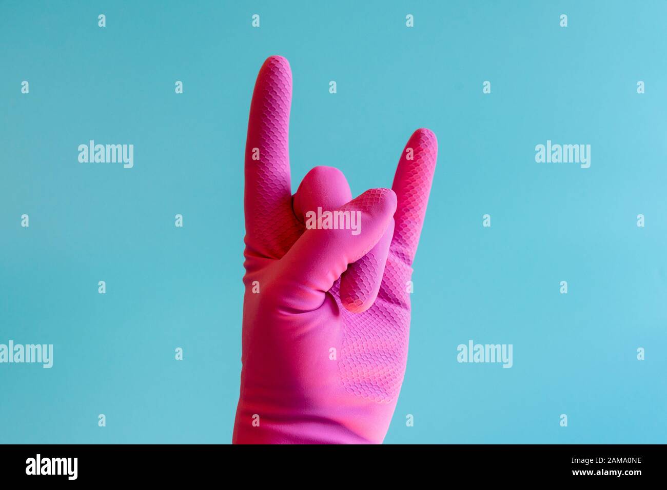Hand with cleaning glove making fist Stock Photo - Alamy