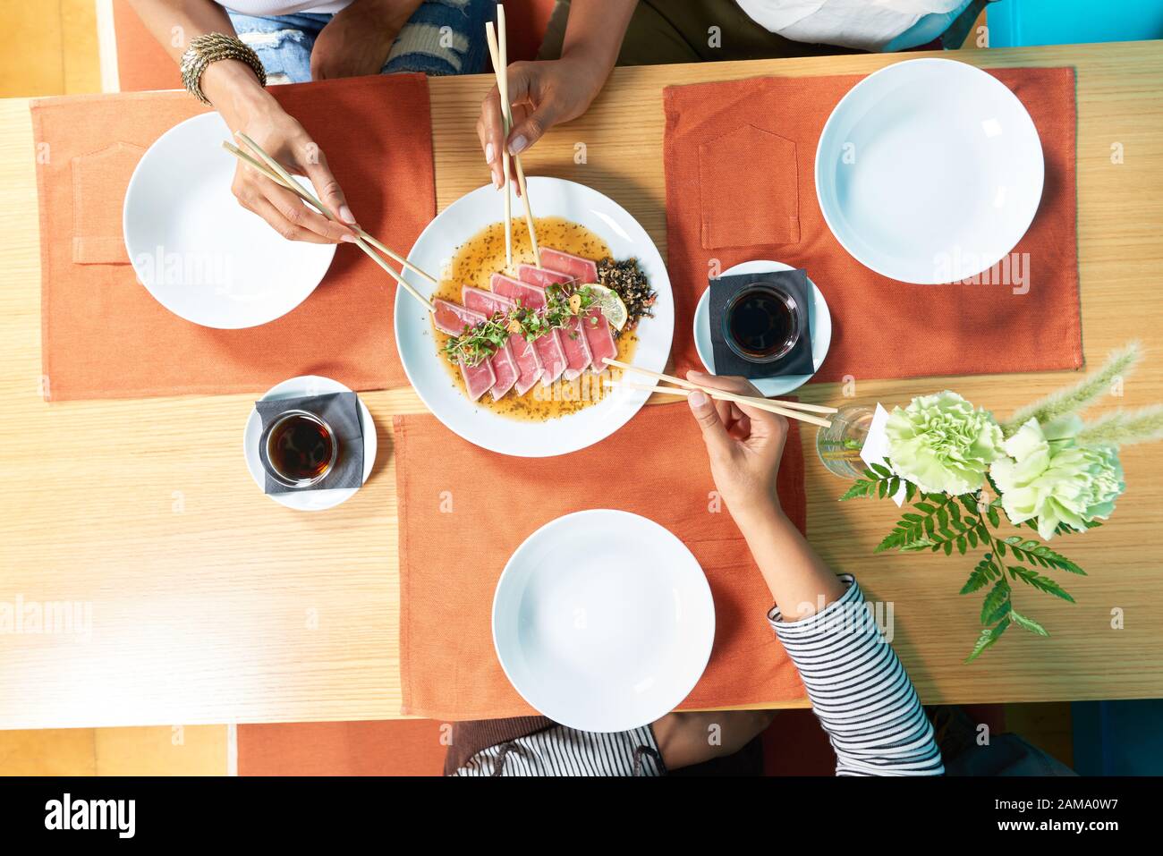 Ladies enjoying dinner at a restaurant Stock Photo - Alamy