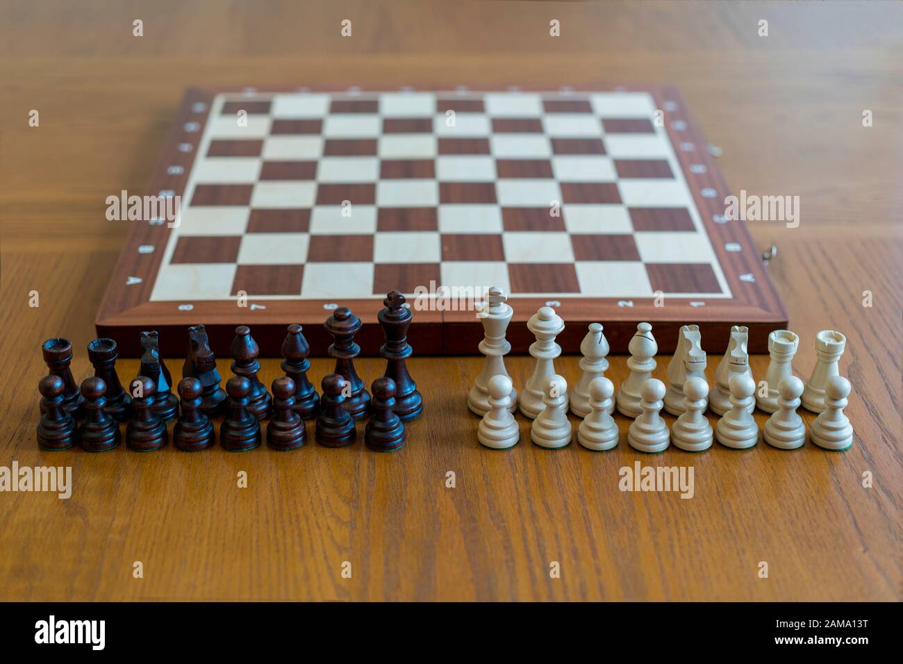 Chess pieces in front of a chessboard Stock Photo - Alamy