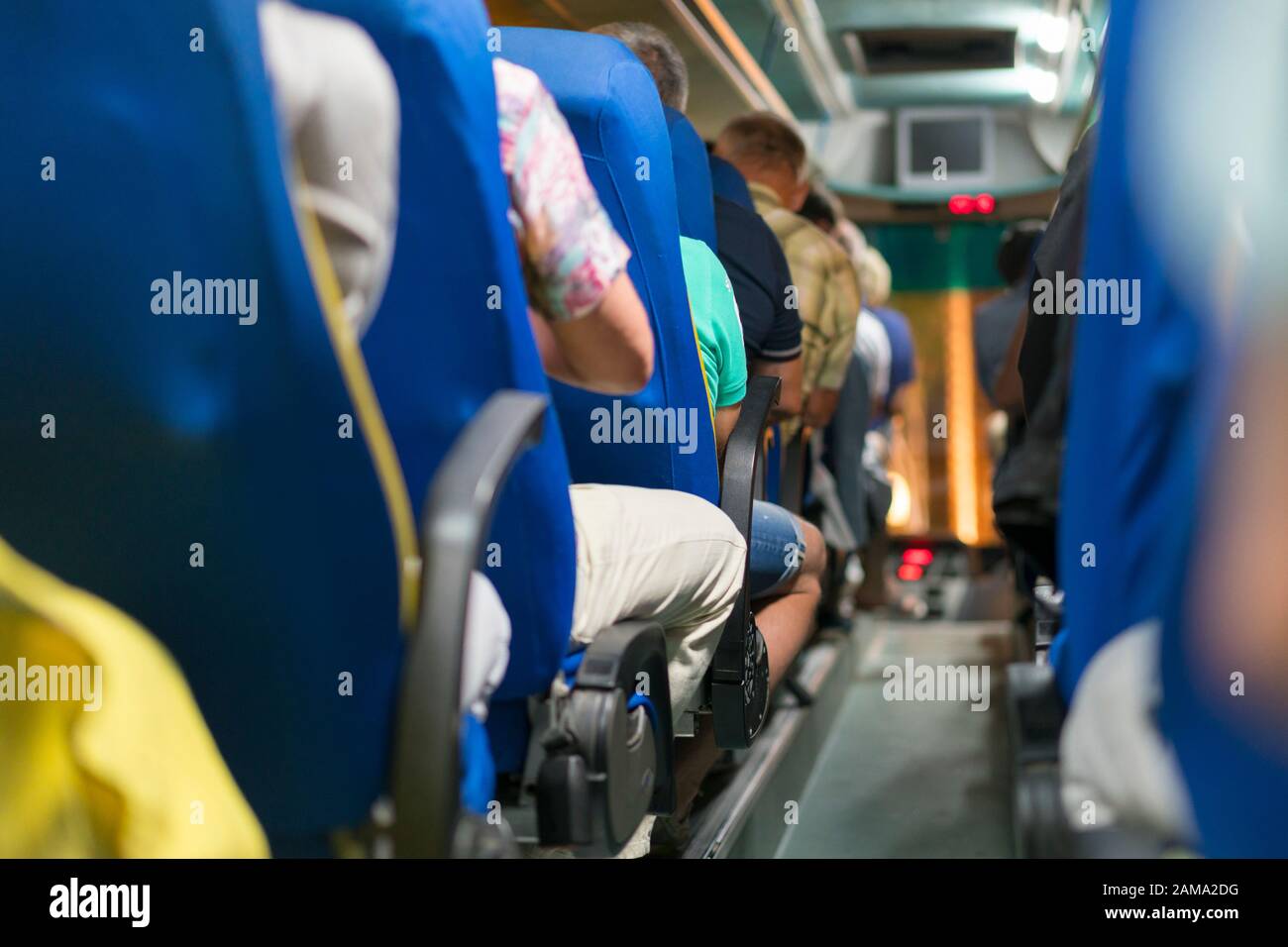Passengers on a tourist bus. selected focus Stock Photo - Alamy