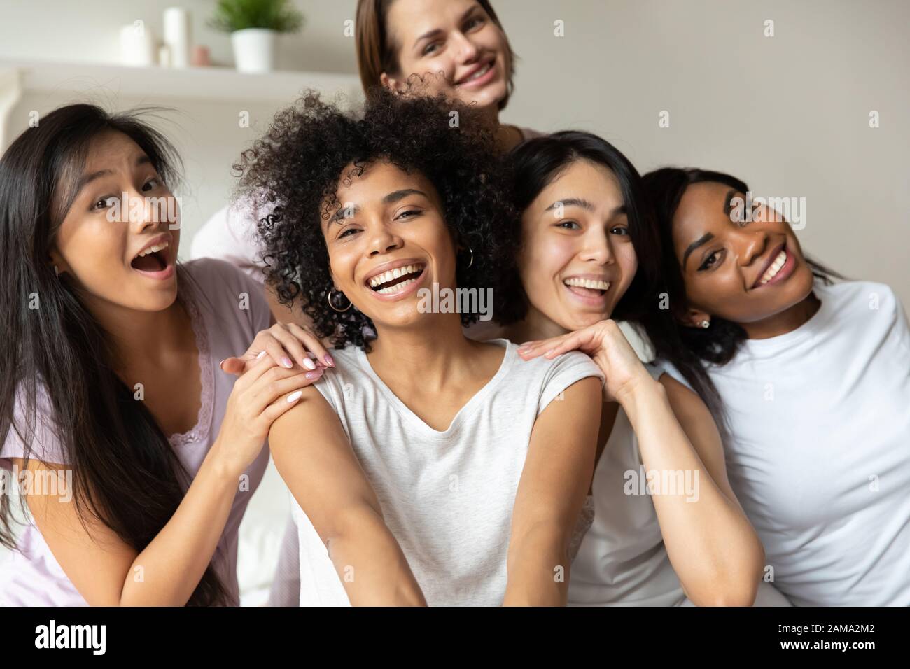 Happy millennial girls smile for picture at hen party Stock Photo - Alamy
