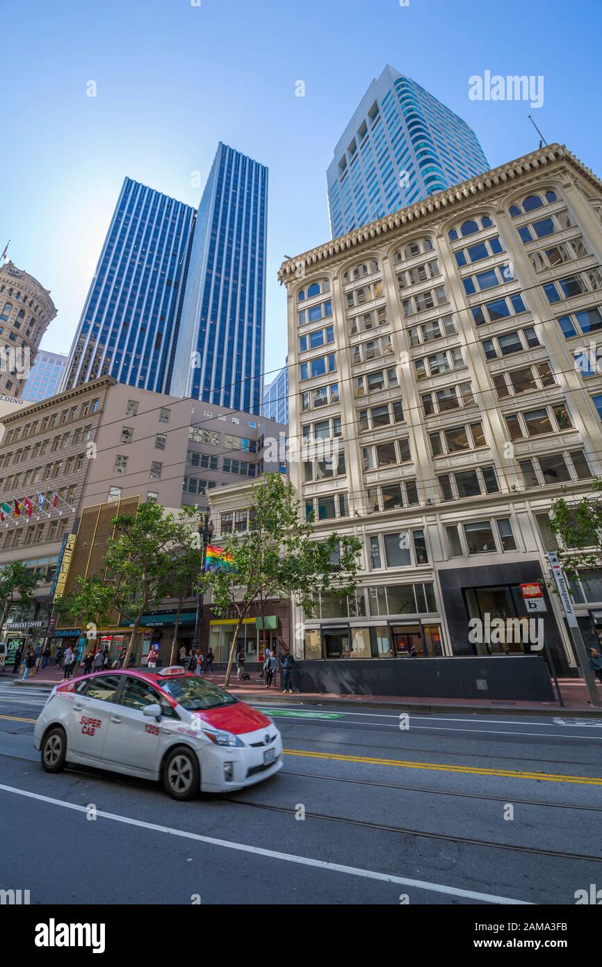 Street scene and tall buildings on Post Street in Downtown, San ...