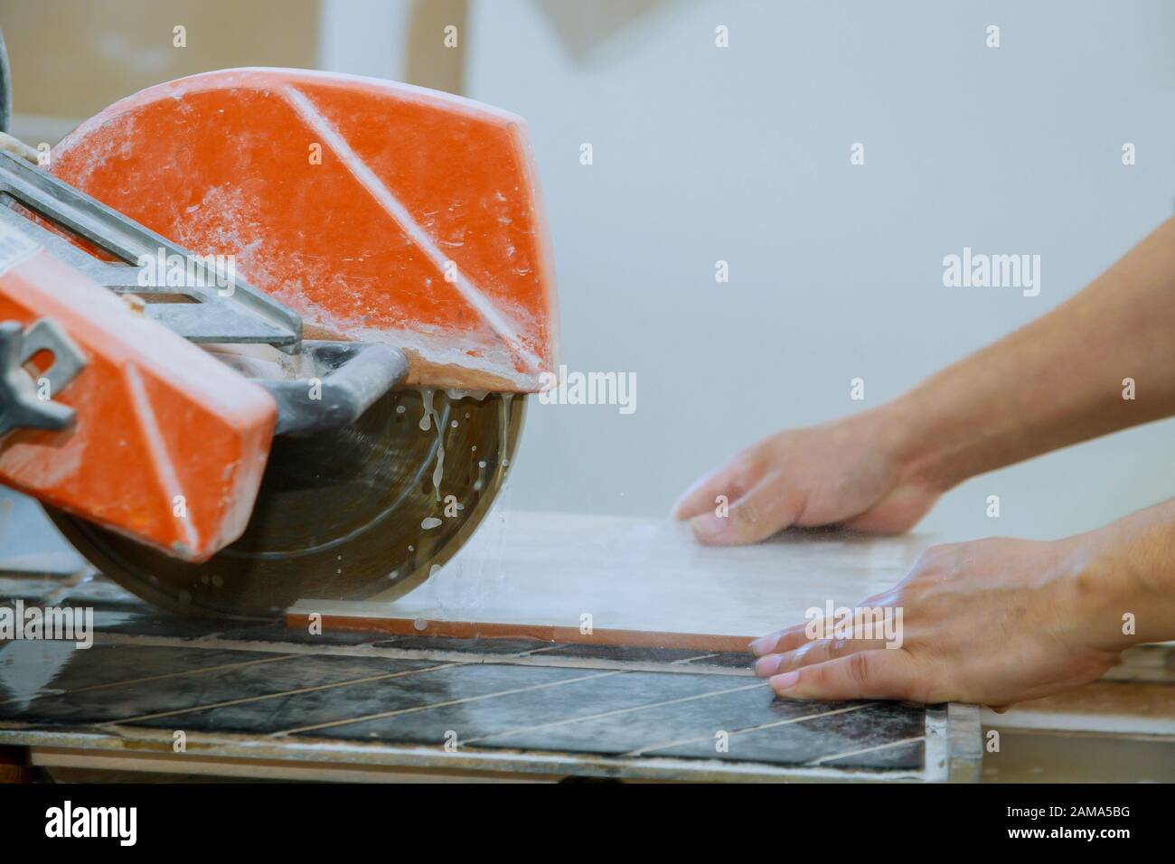 Worker use wet sawing machine for tile cutting equipment on the ...